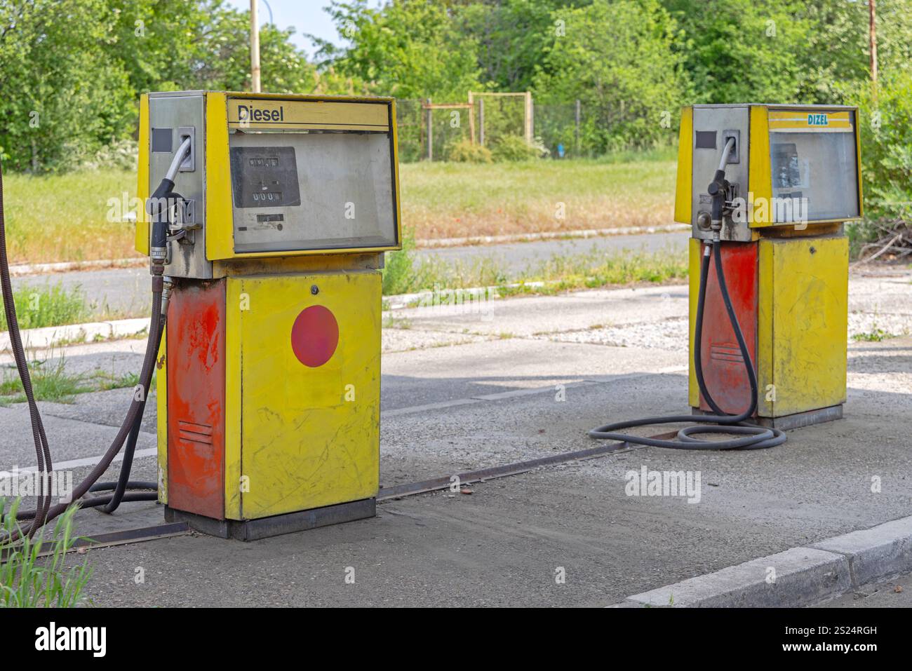 Two Yellow Diesel Pump Gas Oil at Old Fueling Station Stock Photo - Alamy