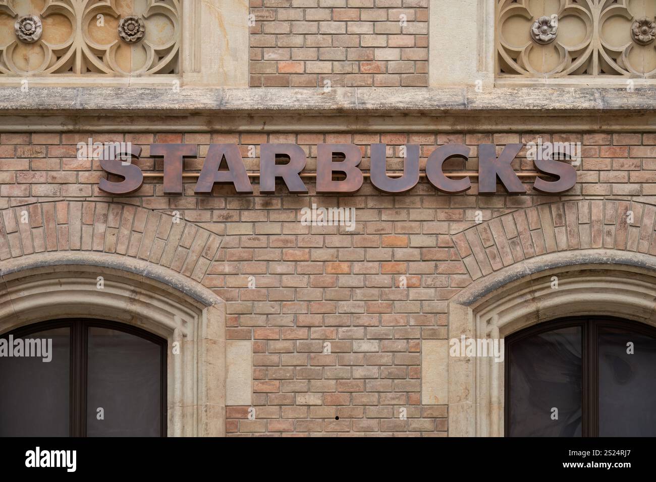 Prague, Czech Republic. October 4, 2024 - Starbucks logo on a historic ...