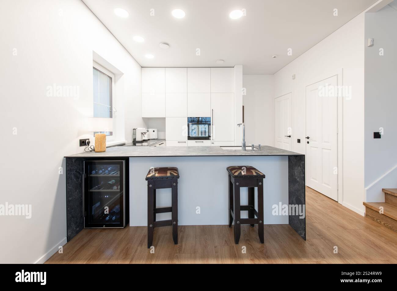 Bright and contemporary kitchen interior featuring a minimalist design ...