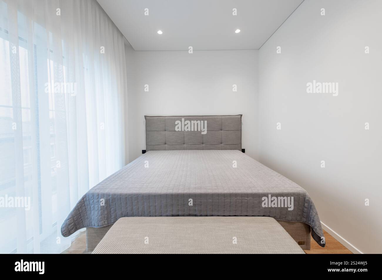 Contemporary home bedroom featuring a simple yet stylish gray bedding ...