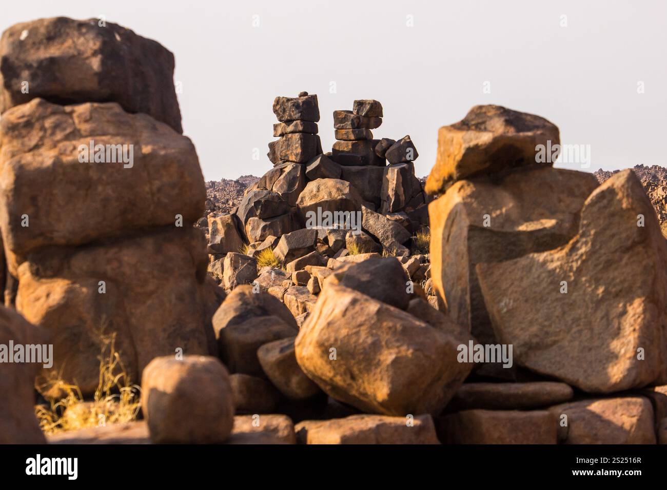 Strangely shaped towers of stacked rocks among in the eroded landscape ...