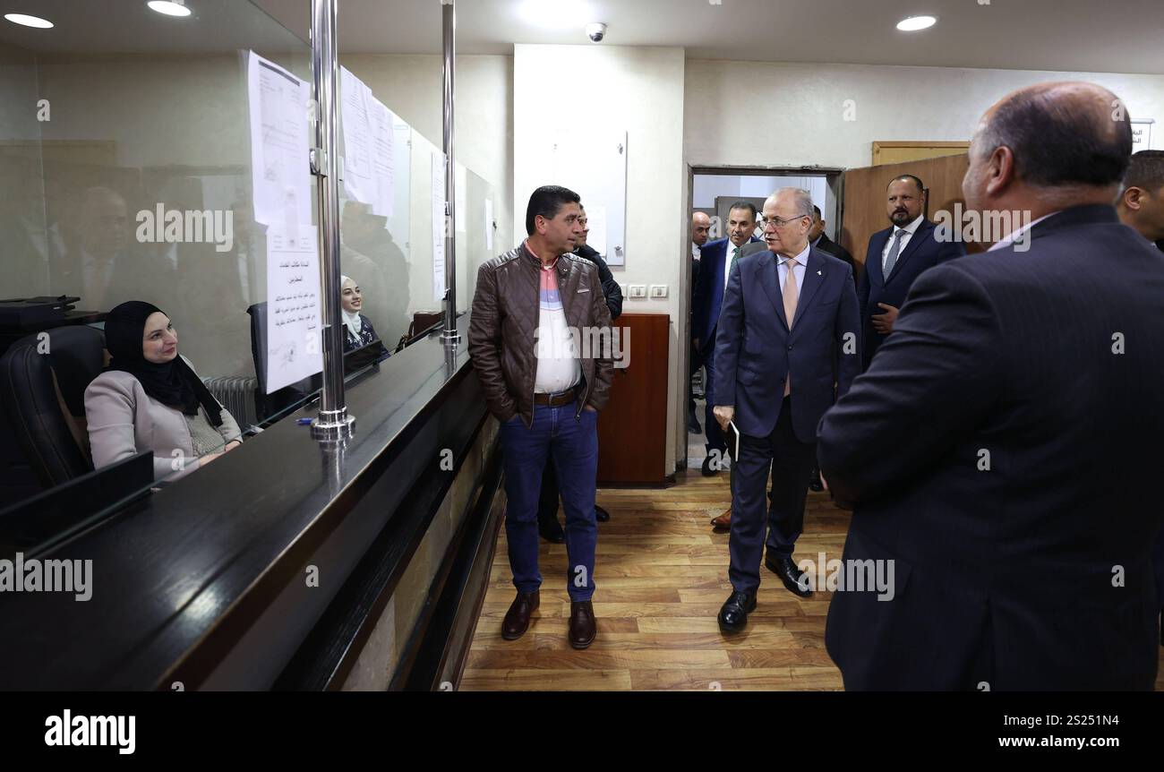 Palestinian Prime Minister Mohammad Mustafa inspects the Ministry of ...