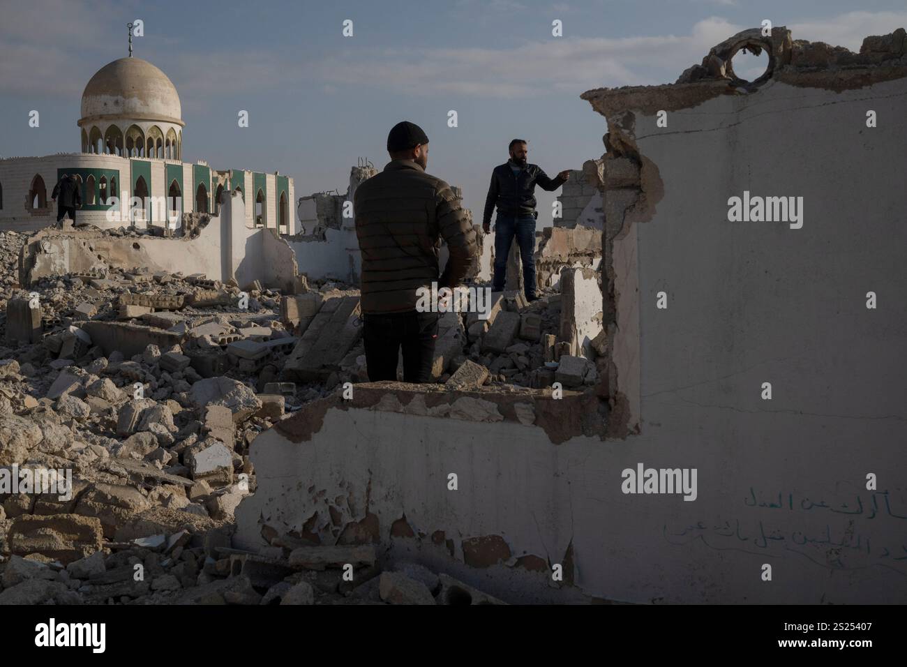 Khalifa Abdala Khalifa, right, stands on the site where was one of the ...