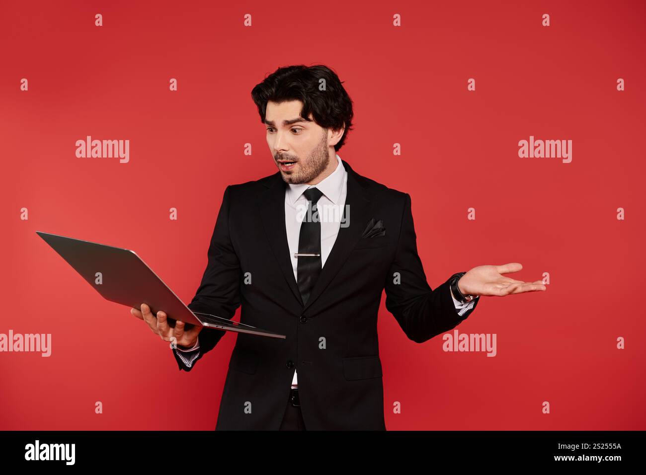 Engaged in a surprising conversation, a young man showcases his ...