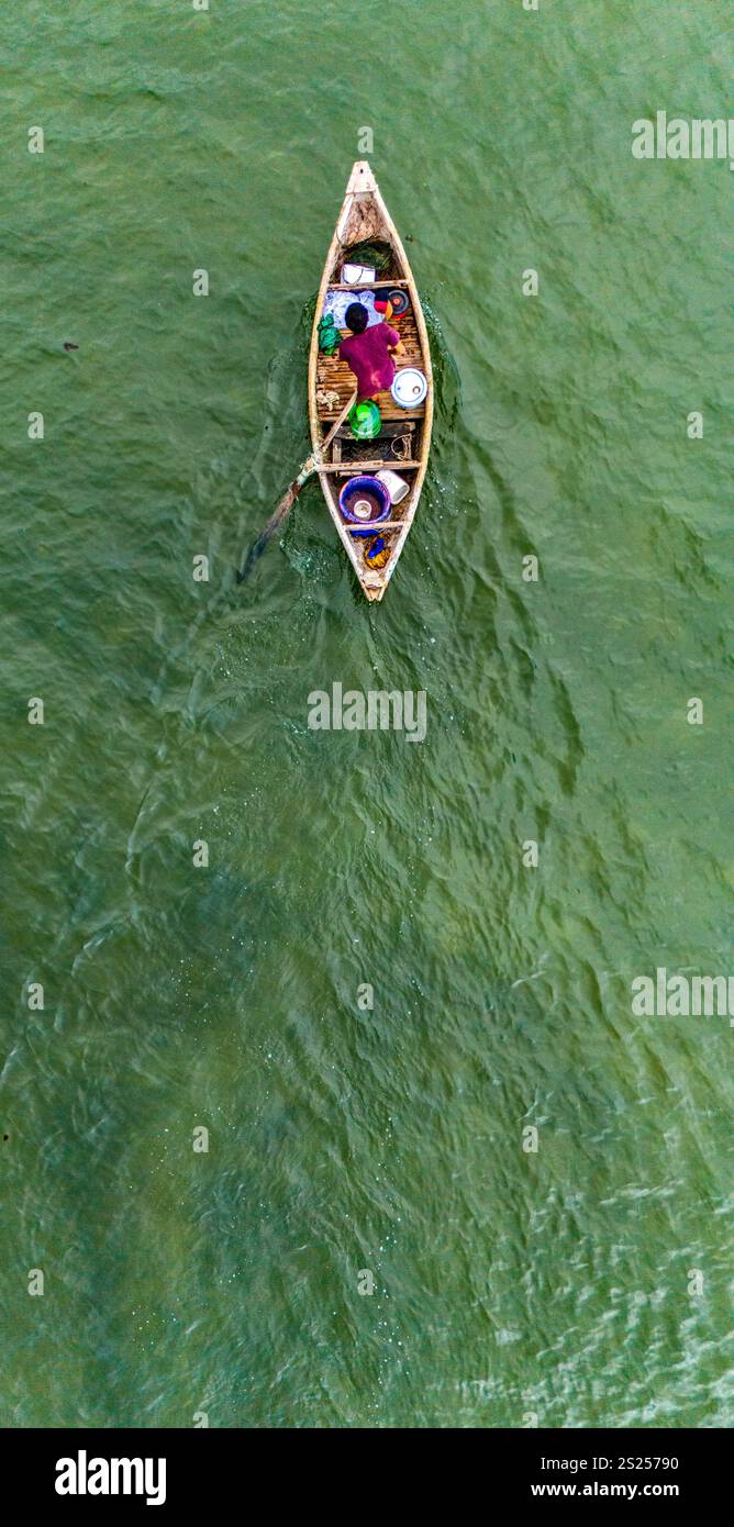 Aerial view of a typical Vietnamese boat, person paddling and carrying ...