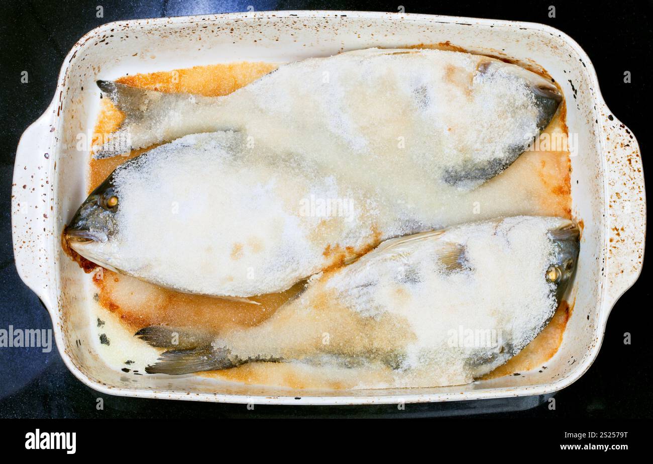 three dourada fish baked in salt Stock Photo - Alamy