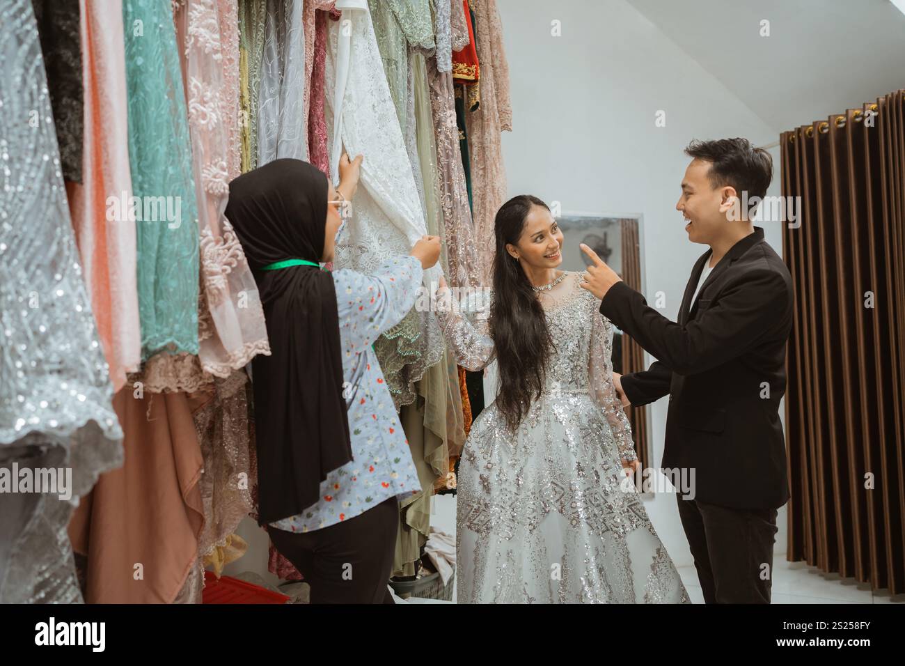 An Elegant Dress Fitting Session Takes Place in a Fashion Studio ...