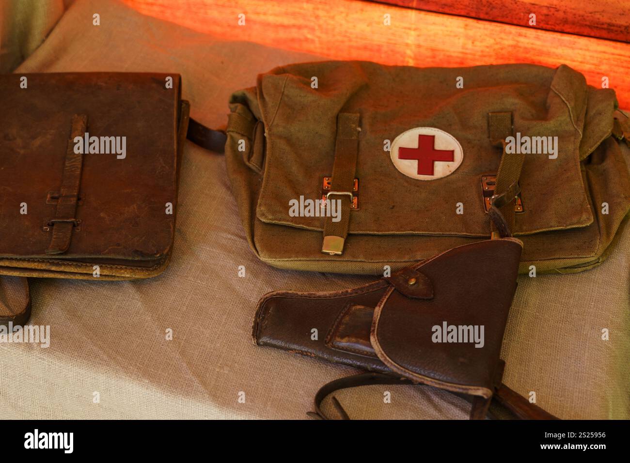 A collection of vintage medical supplies is displayed on a neutral ...