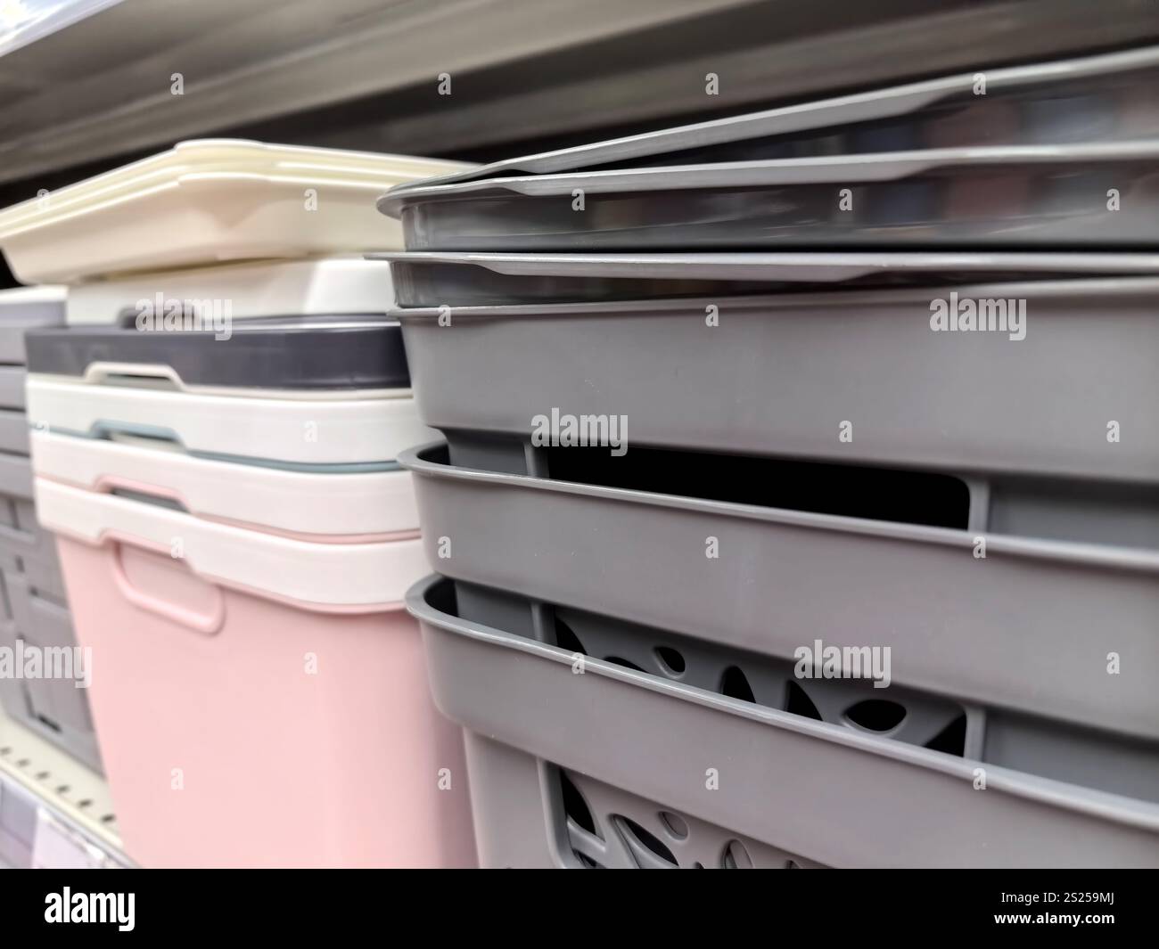 A vibrant display of neatly stacked storage containers showcases ...