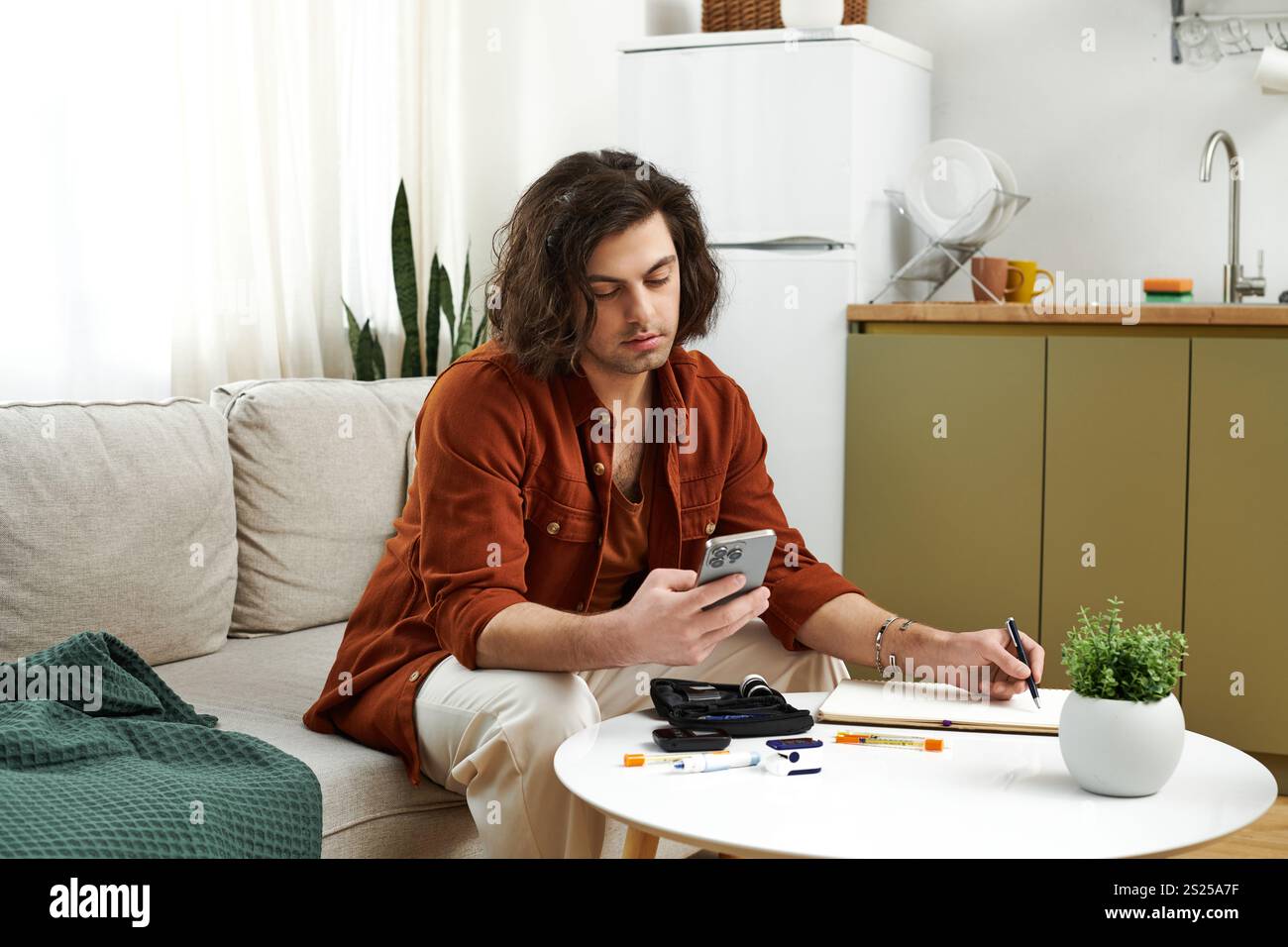 In a stylish apartment, a young man with diabetes engages in his daily ...