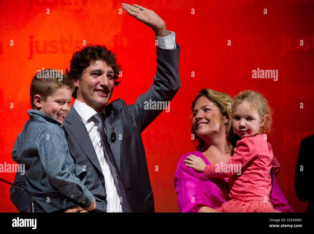 FILE - Liberal MP Justin Trudeau waves to the crowd of supporters while ...