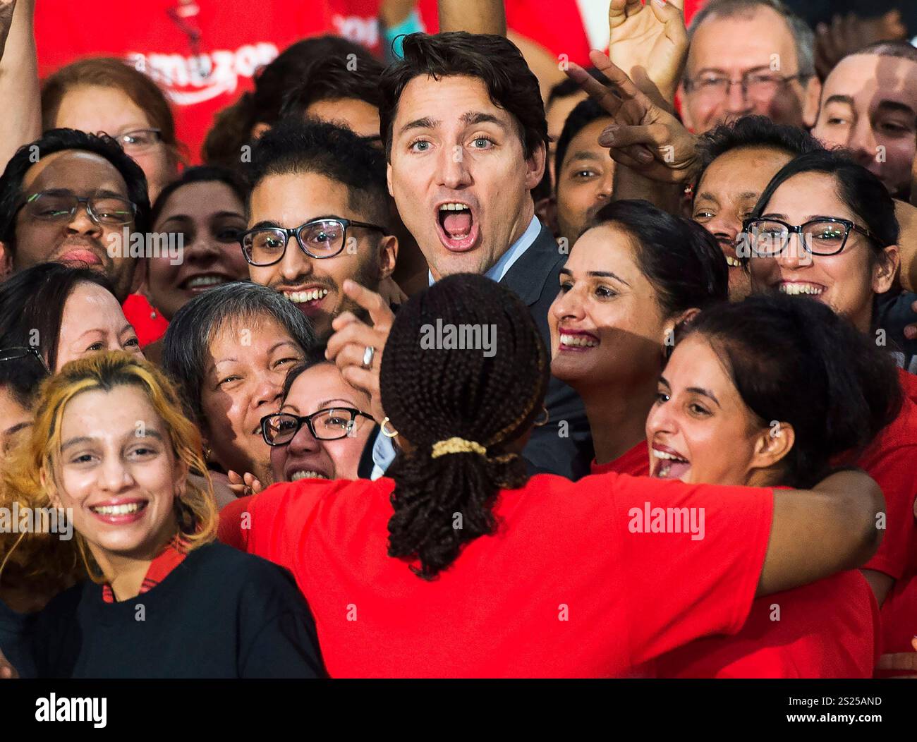FILE - Canada's Prime Minister Justin Trudeau is swarmed by employees ...
