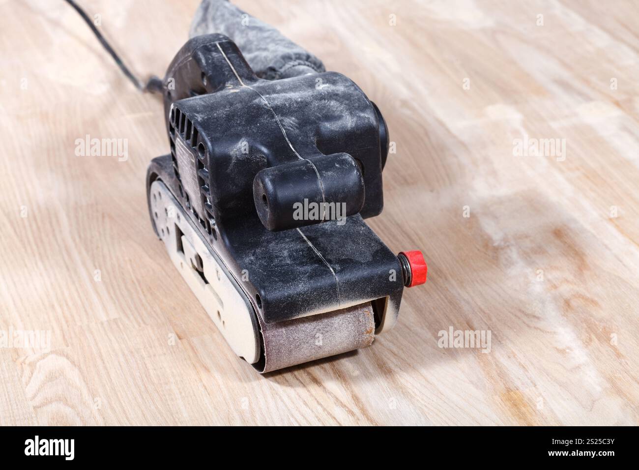 hand-held belt sander sanding ashwood surface Stock Photo - Alamy