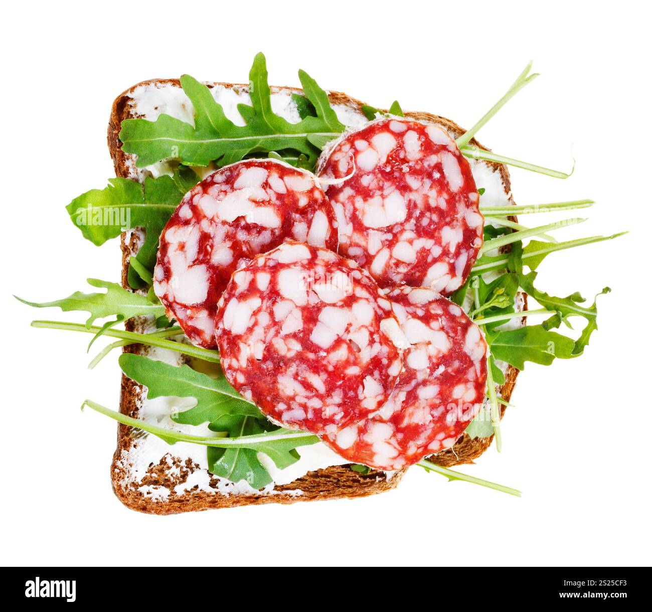 sandwich from rye bread, soft cheese, salami and fresh arugula isolated ...