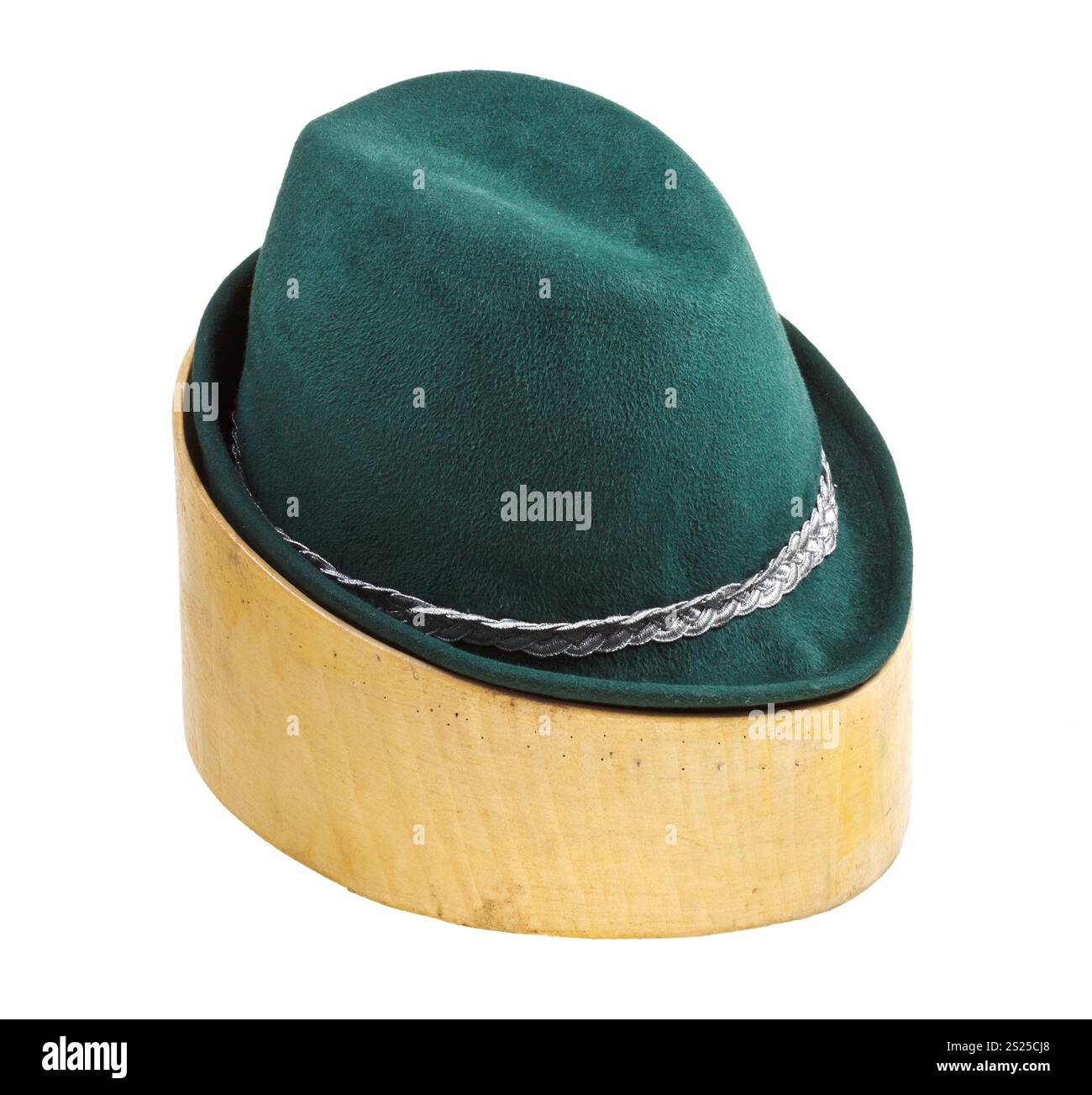 green tyrolean felt hat on linden wooden hat block isolated on white ...