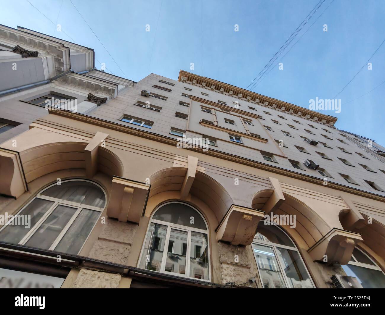 A facade with arched windows and decorative geometric structures on a ...