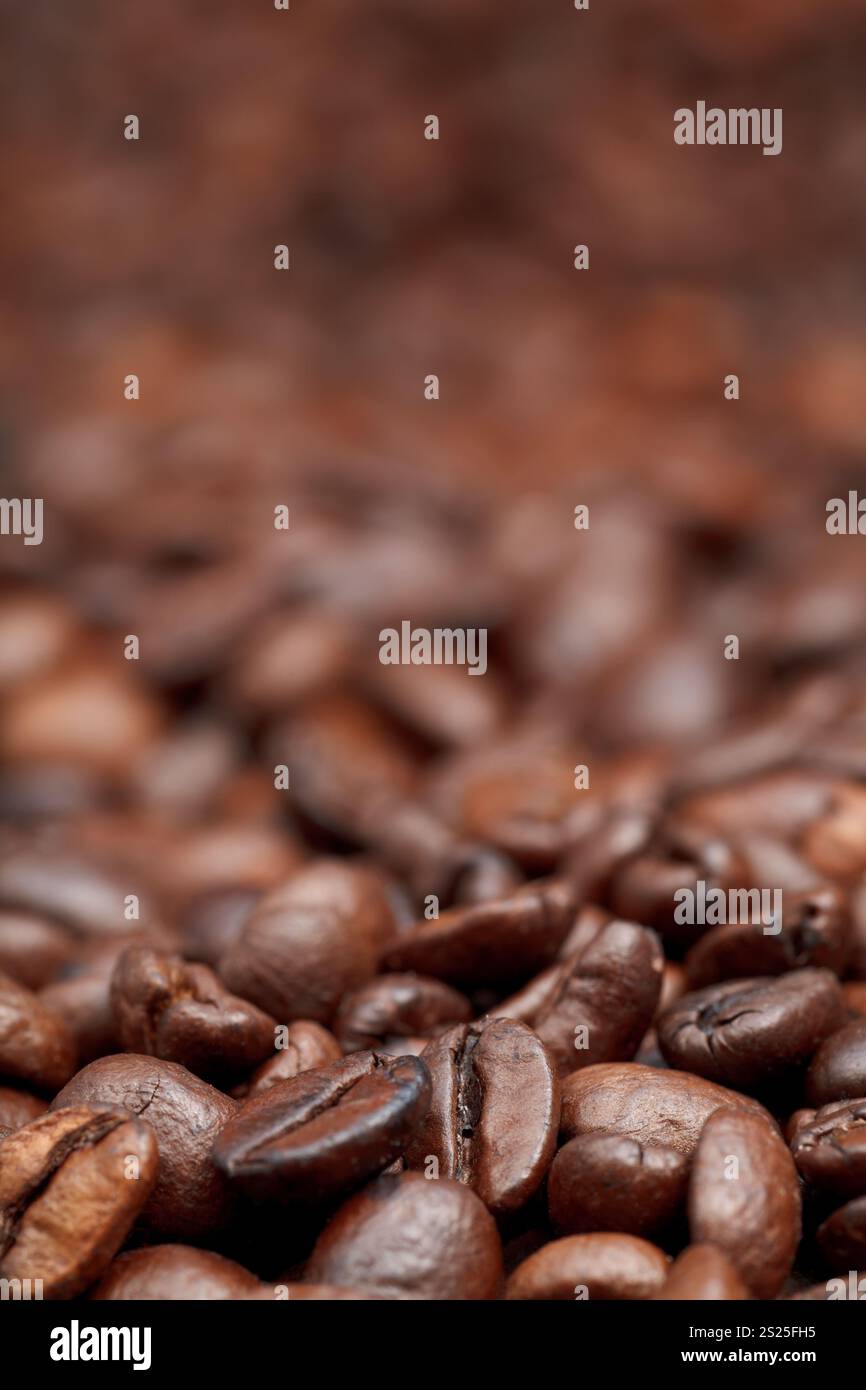 strong roasted coffee beans background with focus foreground Stock ...