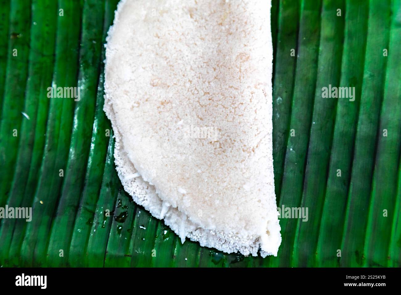 Traditional Brazilian tapioca with coconut served on a banana leaf ...