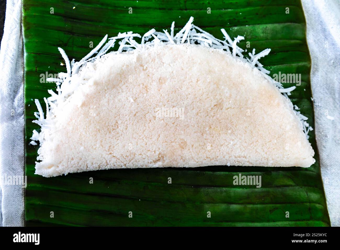 Traditional Brazilian tapioca with coconut served on a banana leaf ...