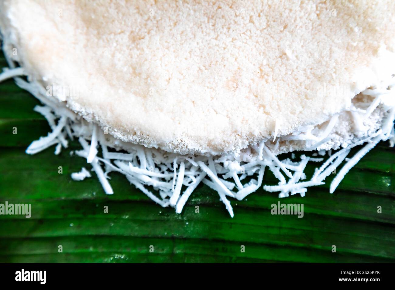 Traditional Brazilian tapioca with coconut served on a banana leaf ...
