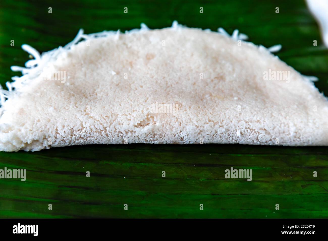 Traditional Brazilian tapioca with coconut served on a banana leaf ...
