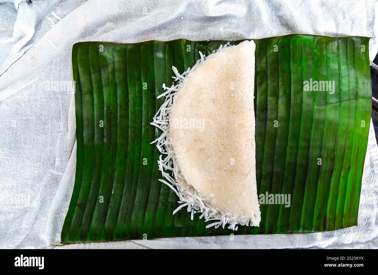 Traditional Brazilian tapioca with coconut served on a banana leaf ...