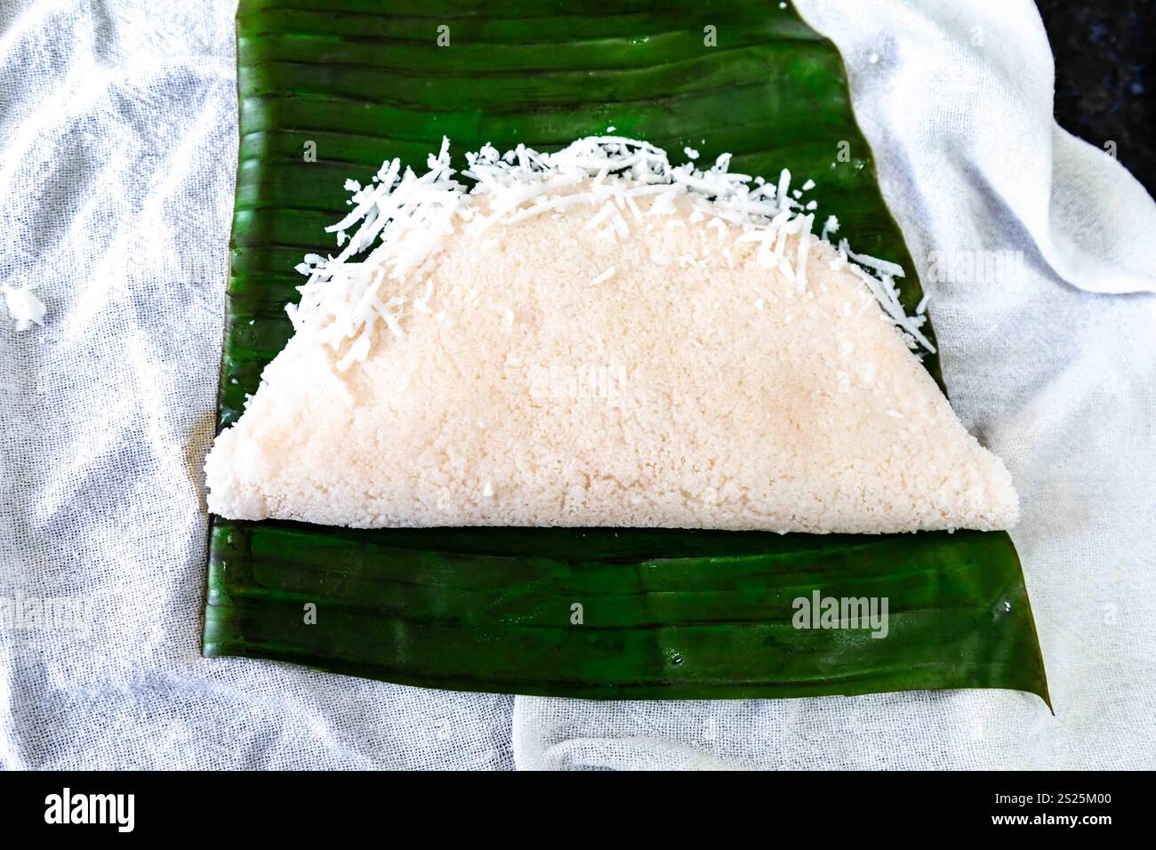 Traditional Brazilian tapioca with coconut served on a banana leaf ...