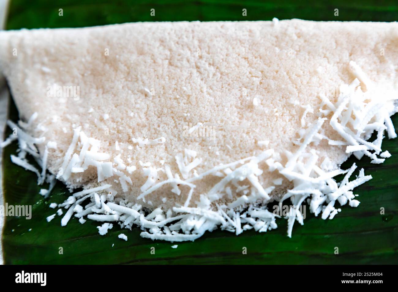 Traditional Brazilian tapioca with coconut served on a banana leaf ...