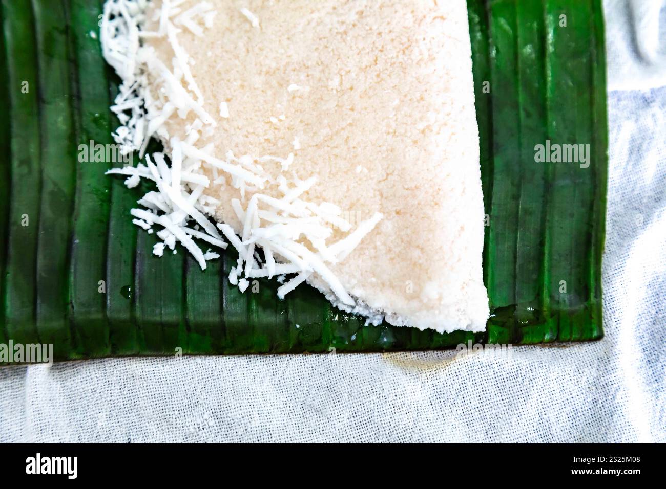 Traditional Brazilian tapioca with coconut served on a banana leaf ...