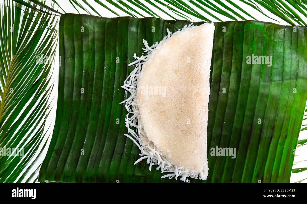Traditional Brazilian tapioca with coconut served on a banana leaf ...