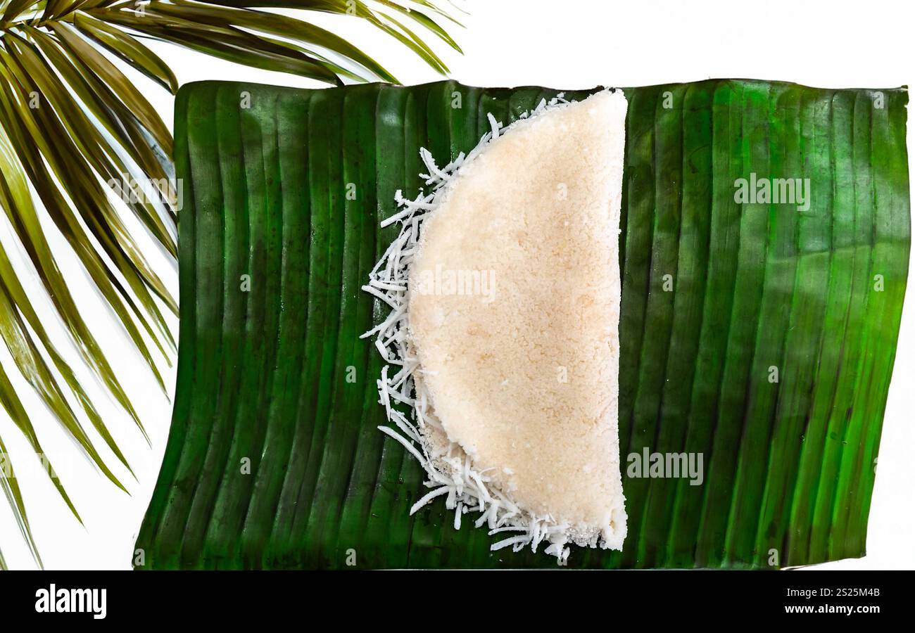 Traditional Brazilian tapioca with coconut served on a banana leaf ...