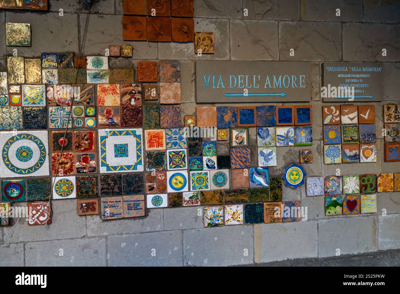 Colorful ceramic tiles line the pedestrian tunnel from the railroad ...