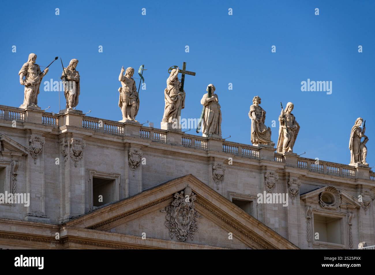 Statues on the roof of the facade of Saint Peter's Basilica in Vatican ...