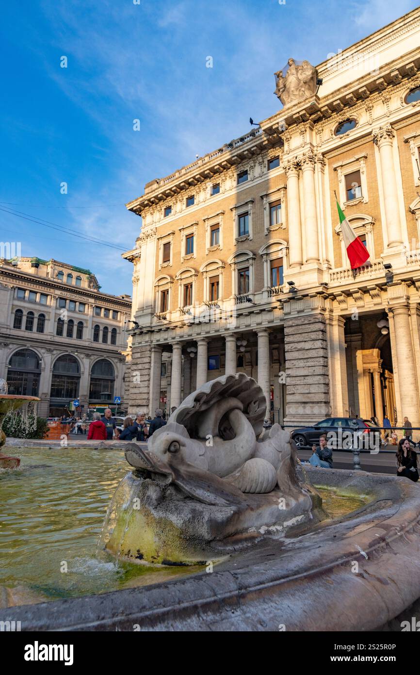 A carved dolphin in the Piazza Colonna fountain with the Galleria ...