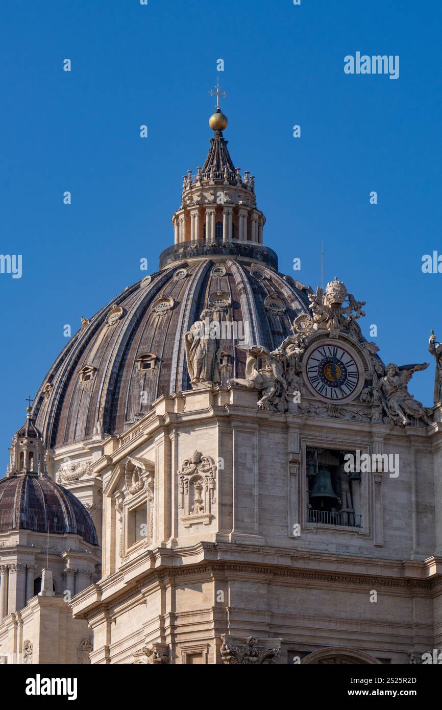 The dome and statues on the roof of the facade of Saint Peter's ...