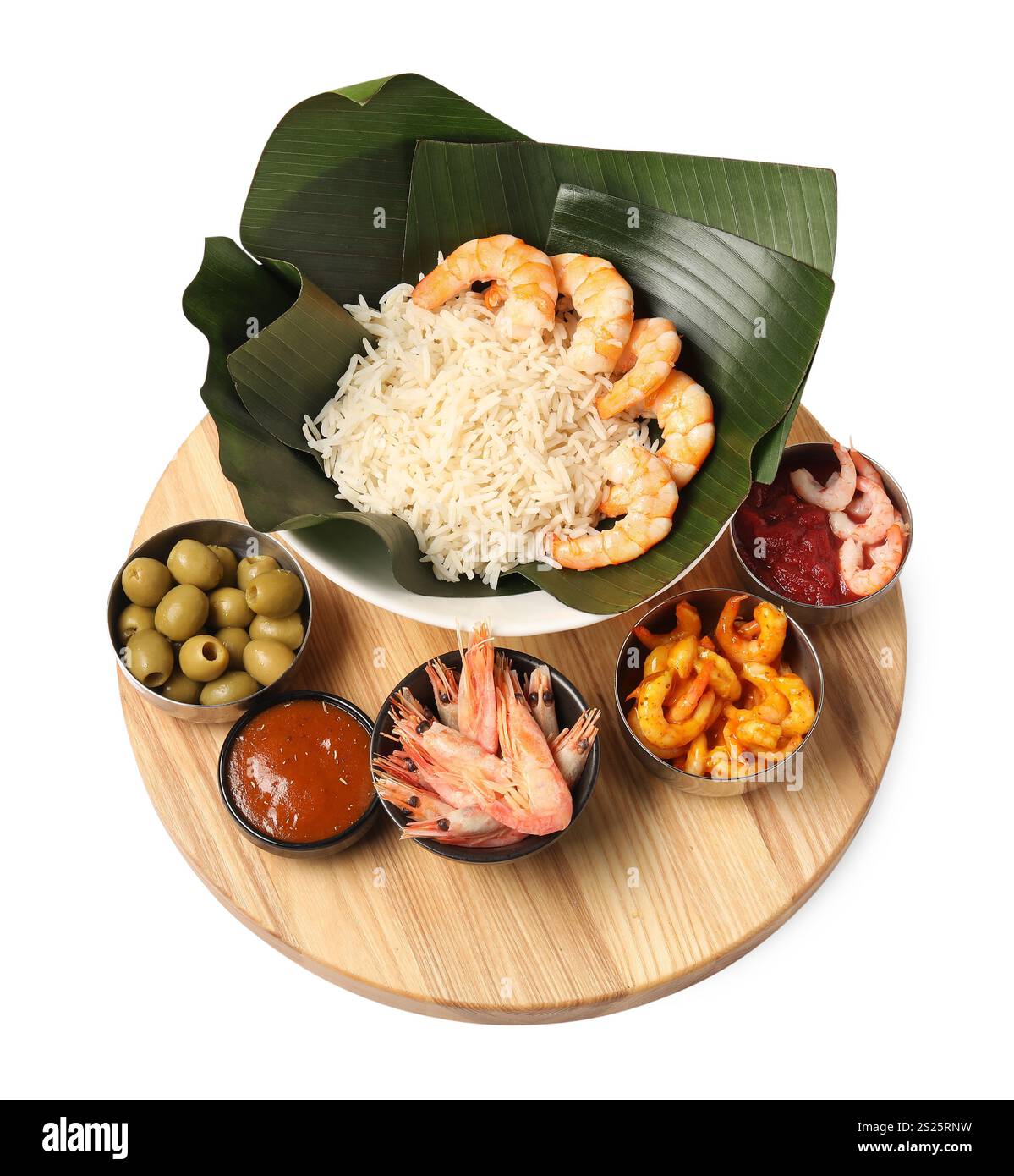 Cut banana leaves with different food and sauce isolated on white ...