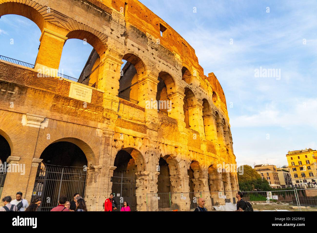 The ancient Roman Colosseum or Flavian Amphitheater with golden sunset ...