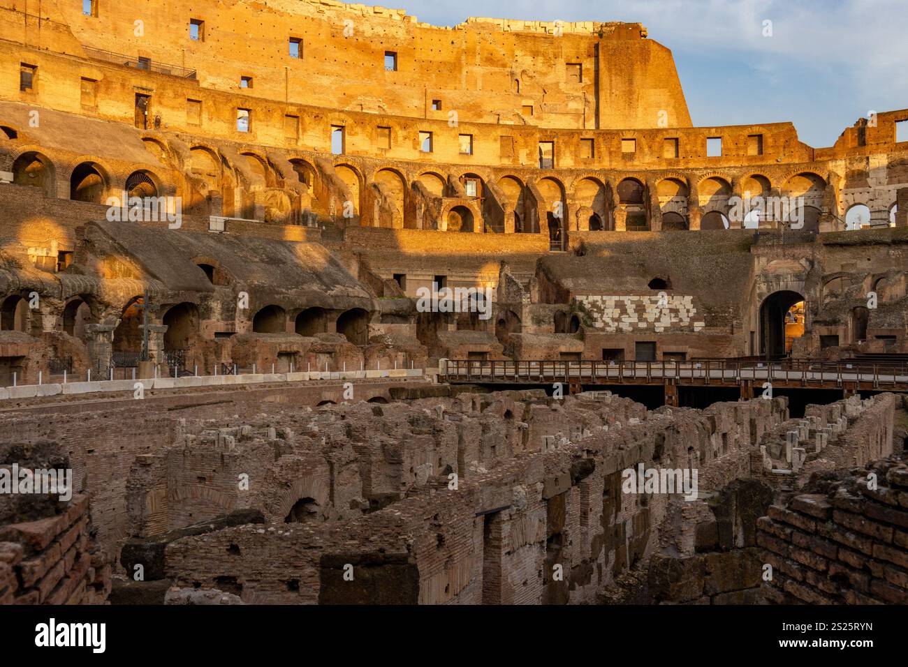 Interior of the Roman Colosseum or Flavian Amphitheater with golden ...