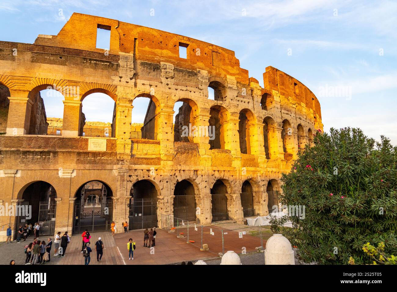 The ancient Roman Colosseum or Flavian Amphitheater with golden sunset ...