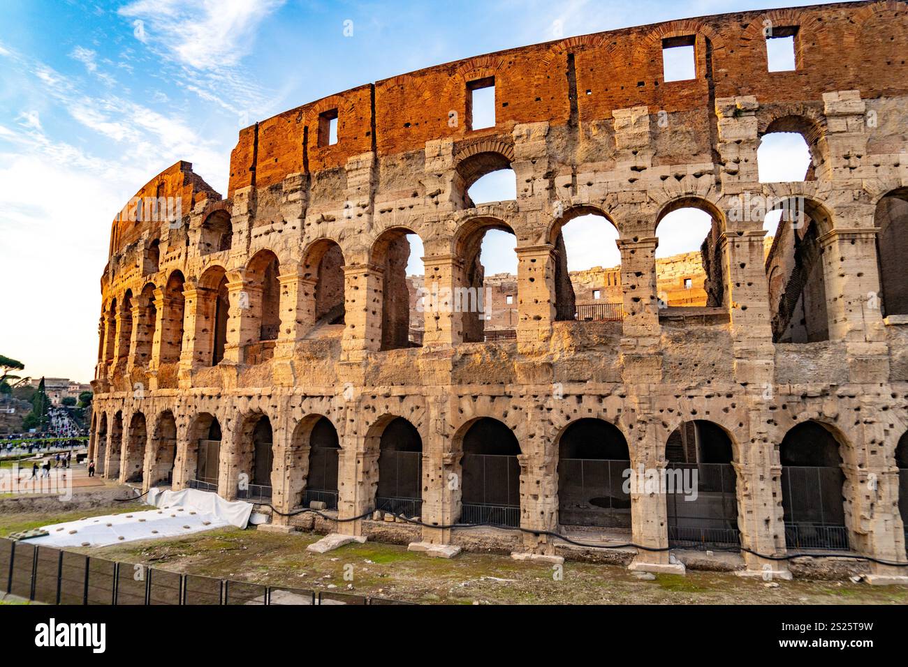 The ancient Roman Colosseum or Flavian Amphitheater with golden sunset ...