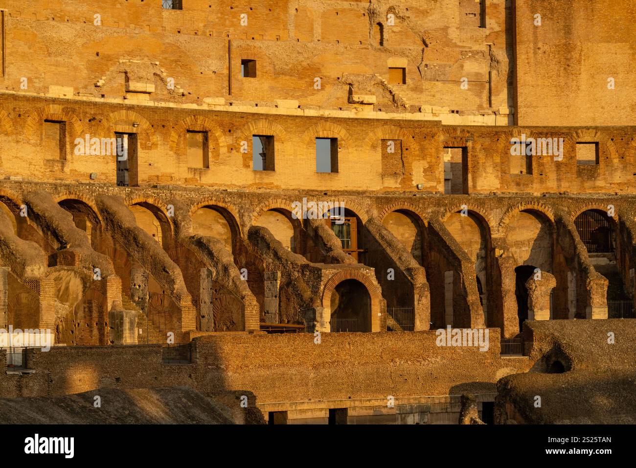 Interior of the Roman Colosseum or Flavian Amphitheater with golden ...
