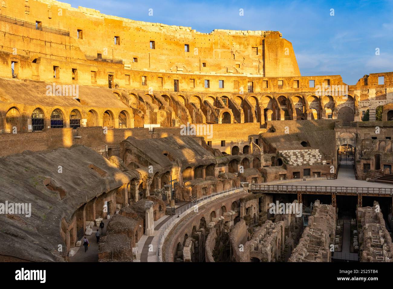 Interior of the Roman Colosseum or Flavian Amphitheater with golden ...