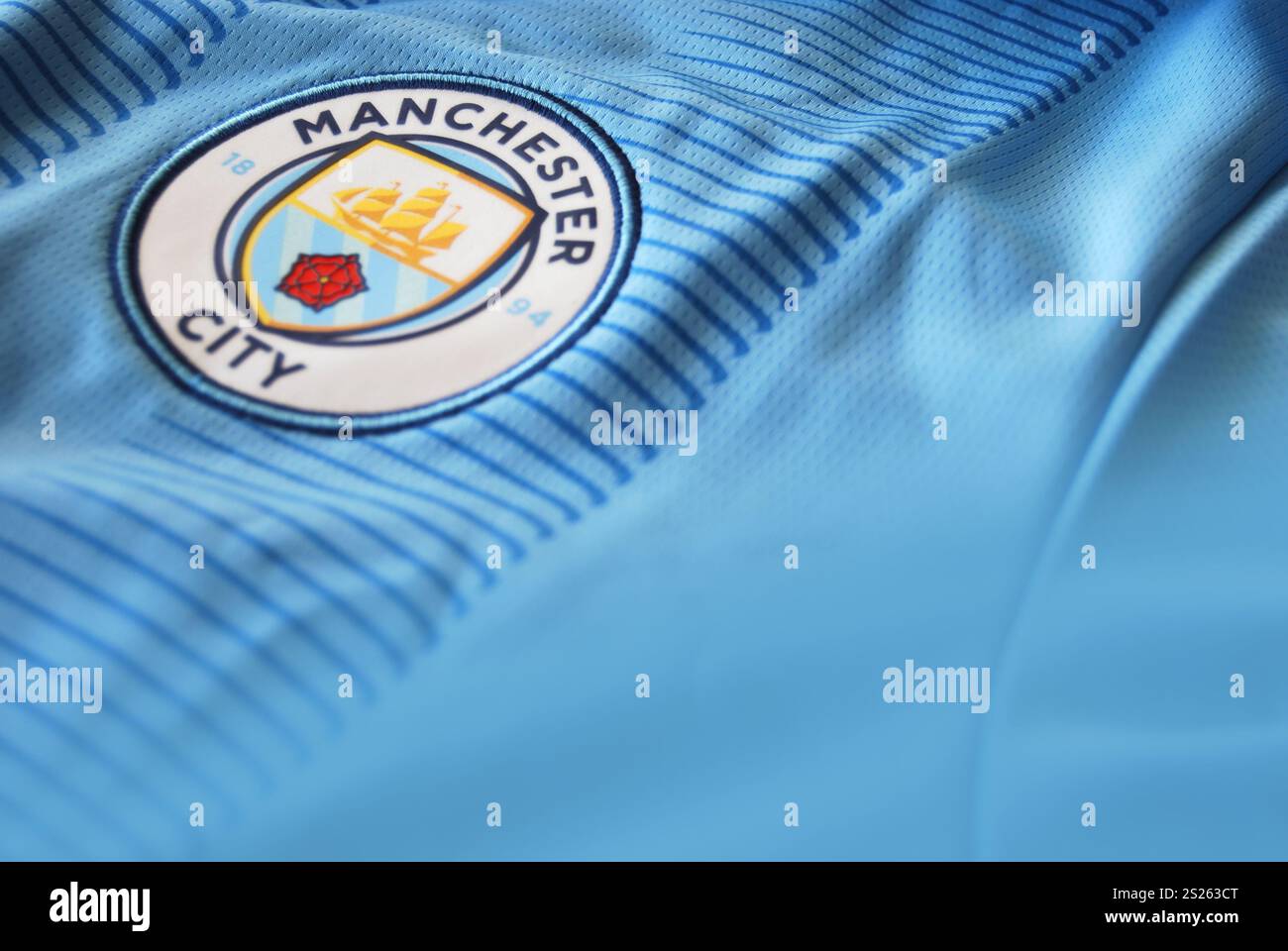 Angled close up photo of Manchester City club badge on the shirt with ...
