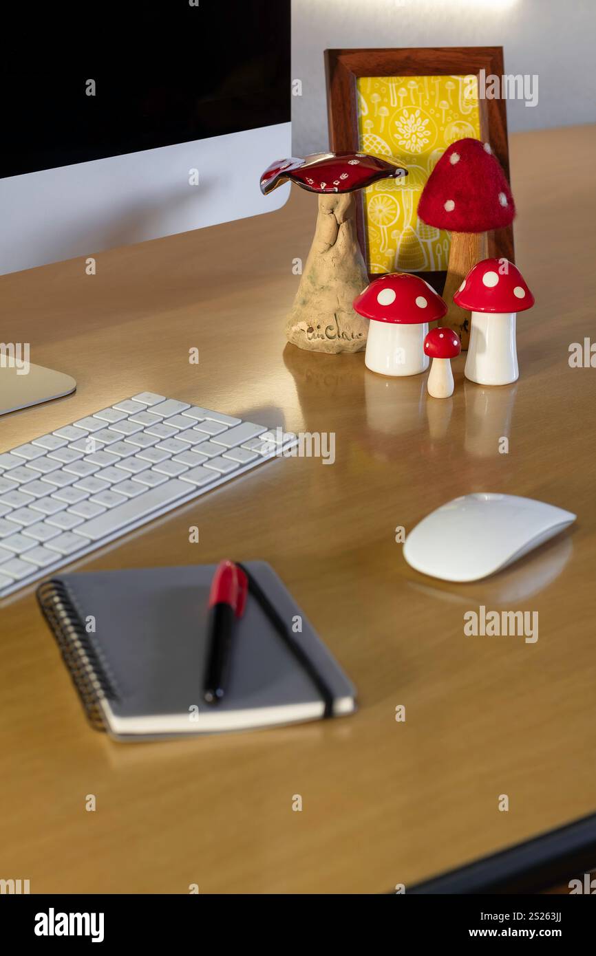 Computer desk with mushroom themed ornaments Stock Photo - Alamy