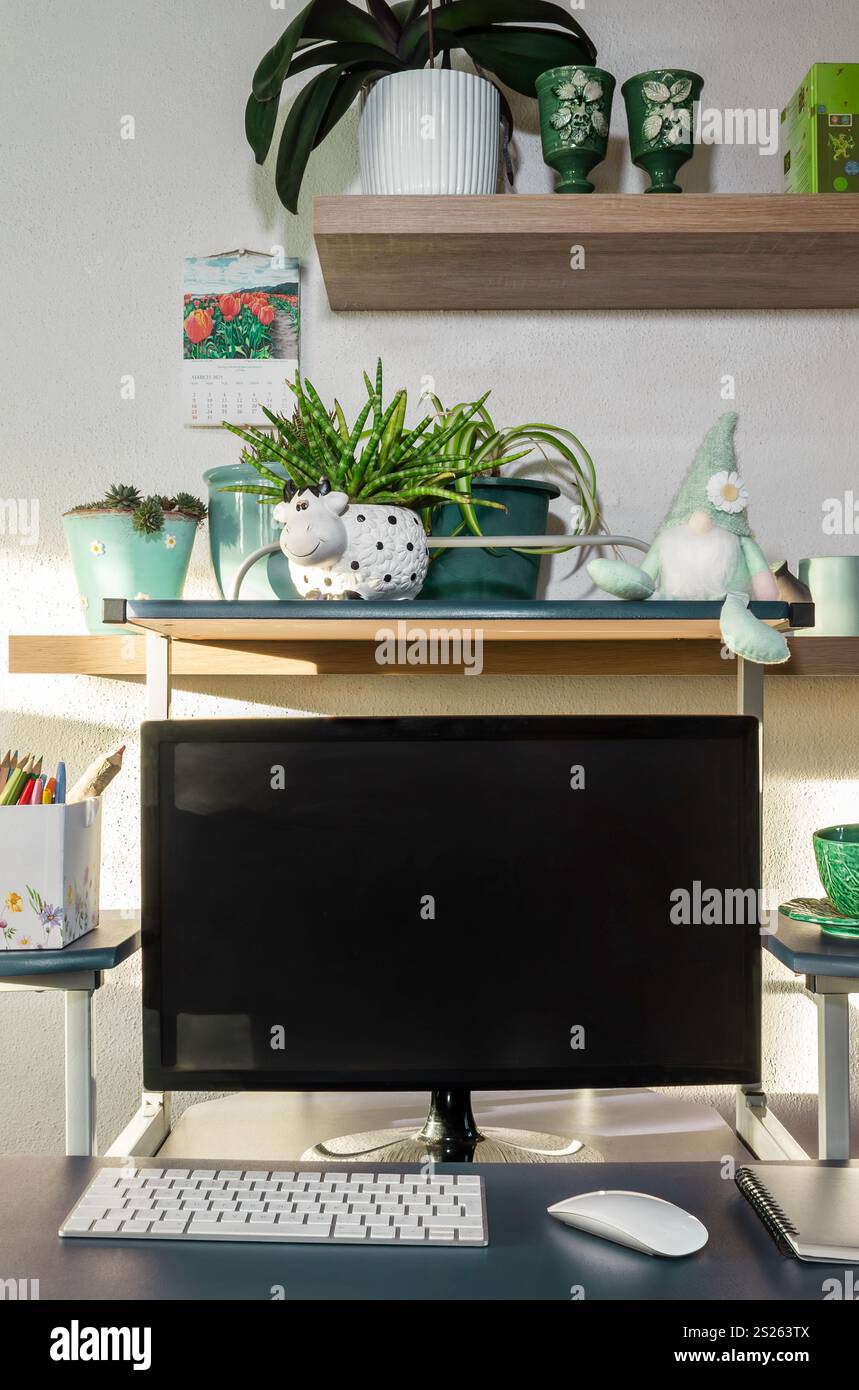 Spring themed desk with plants Stock Photo - Alamy