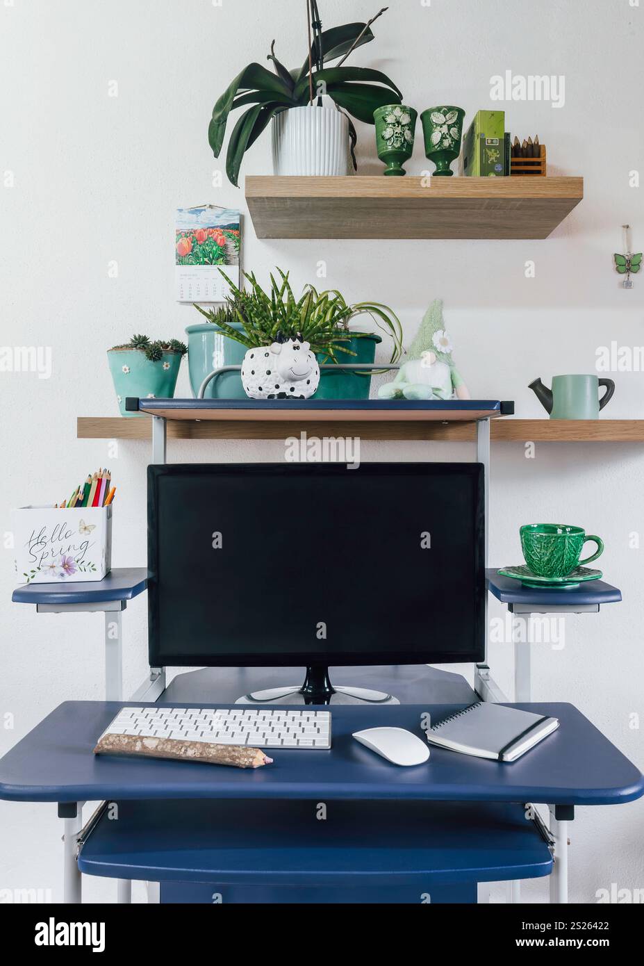 Spring themed desk with plants Stock Photo - Alamy