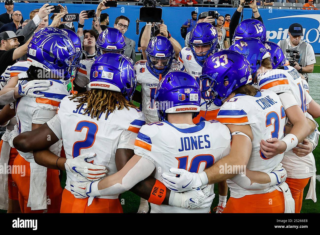 GLENDALE, AZ - DECEMBER 31: The Boise State Broncos offense huddles before the Penn State ...