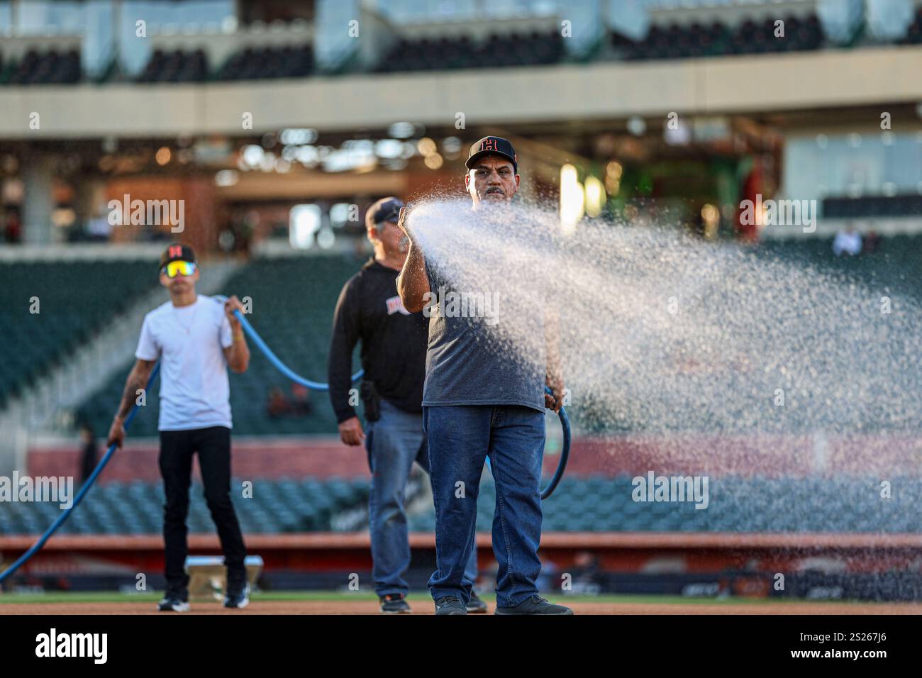 HERMOSILLO, MEXICO - DECEMBER 29: Stadium workers clean the playing ...