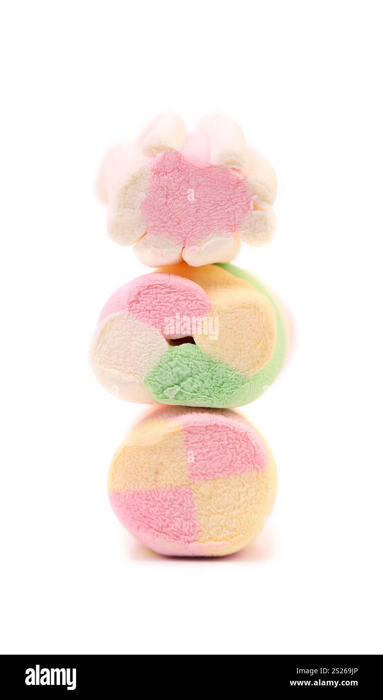 Stack of different colorful marshmallow. Close up. White background ...