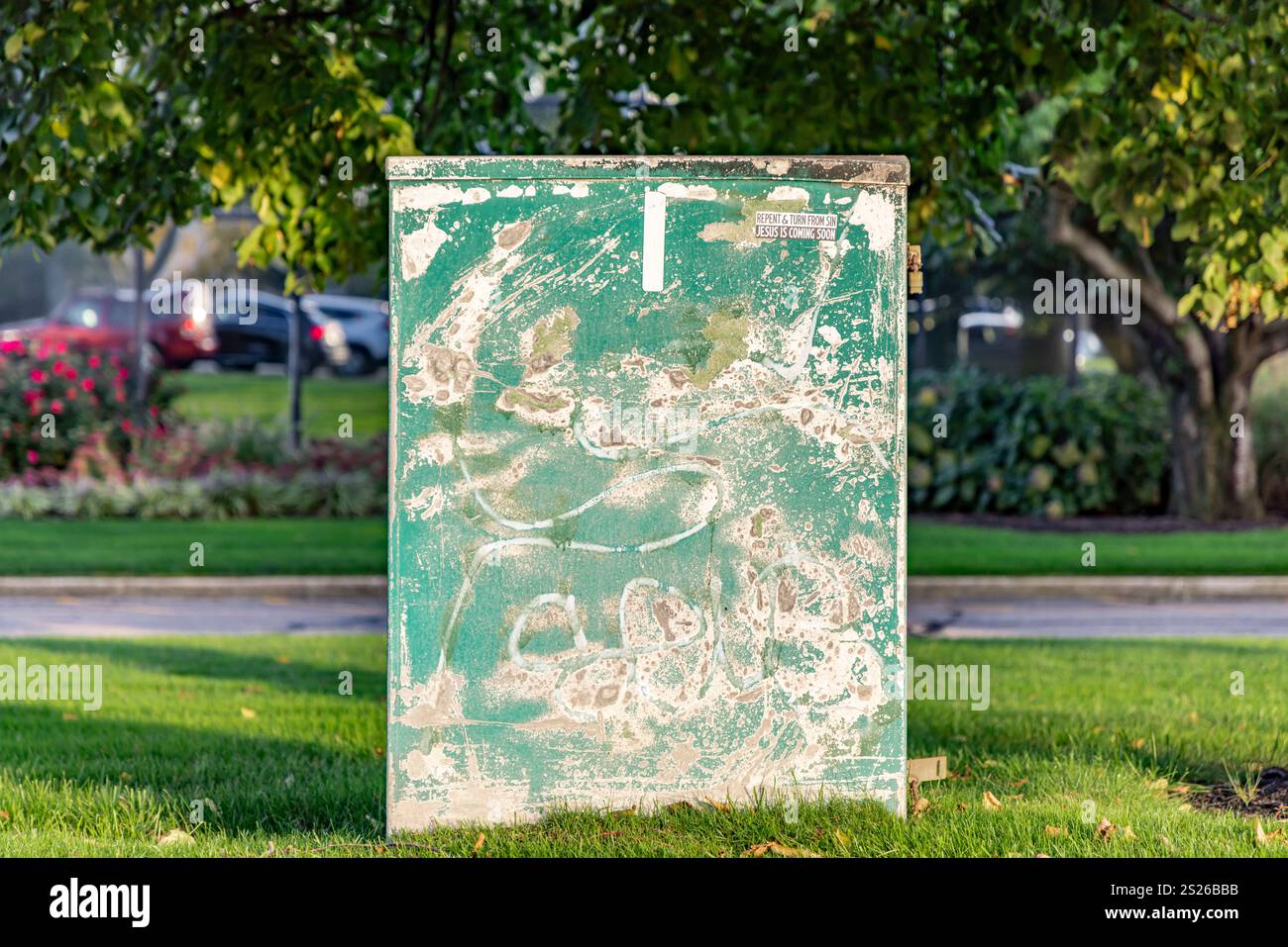 an electrical enclosure with random marks and a sticker Stock Photo - Alamy